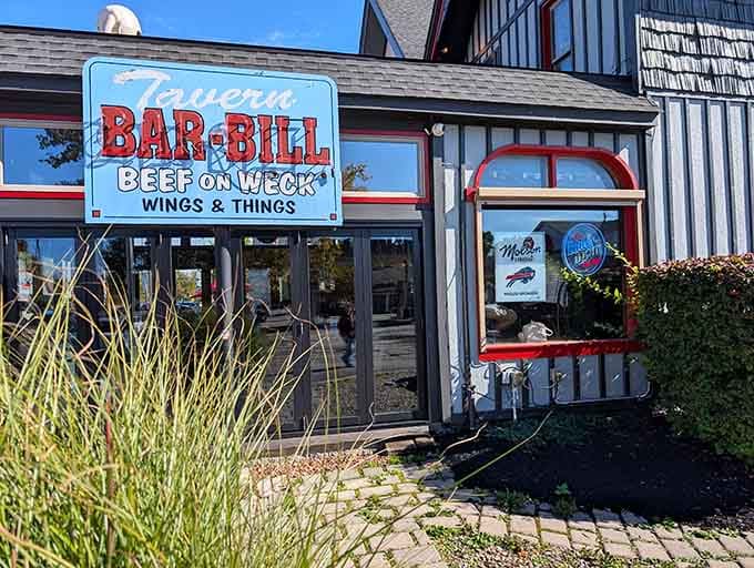 The Bar-Bill Tavern sign announces beef on weck and wings like a delicious beacon of Western New York pride.