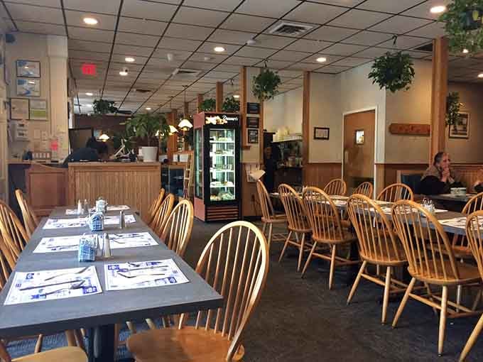 Wooden chairs and cozy booths fill this welcoming space where strangers become regulars and regulars become family over coffee.