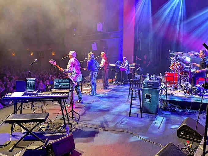 Musicians command the stage where silent films once flickered, proving great venues evolve beautifully.