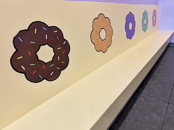 Even the waiting bench gets decorated with donut art, because commitment to theme is everything in this establishment.