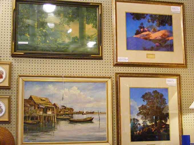 Wall art from different eras creates an eclectic gallery that would make any museum curator slightly envious.