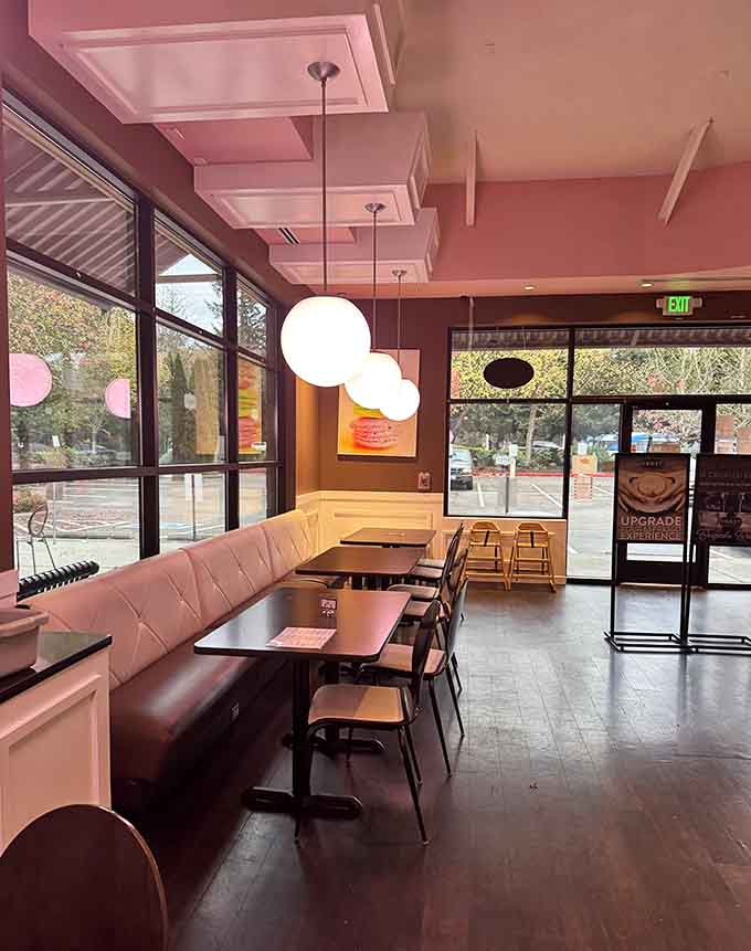 Pink booths and natural light combine to create the perfect spot for lingering over coffee and making poor life choices.