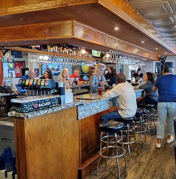 The bar beckons with that warm wood finish and enough glassware to suggest they take drinks seriously here.