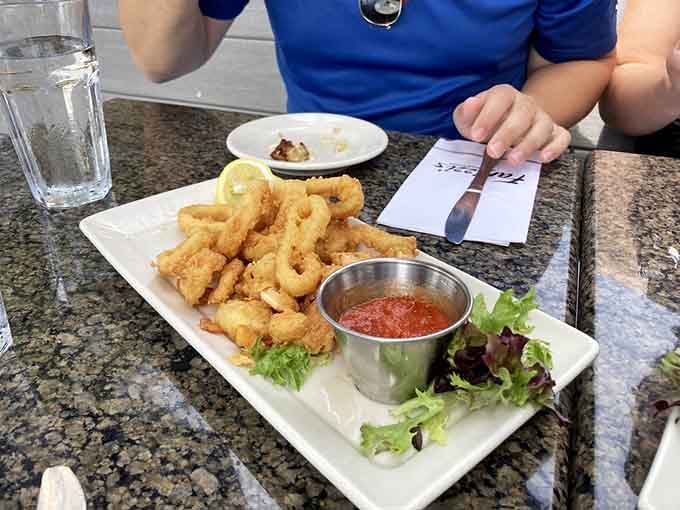 Crispy calamari rings with marinara sauce, the appetizer that's been starting great meals since your kids were in high school.