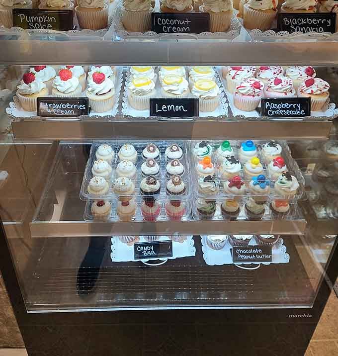 Fresh cupcakes in flavors like lemon, raspberry cheesecake, and pumpkin spice tempt you from their pristine display case.