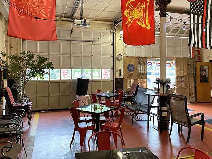 Red firefighter banners hanging overhead remind you this isn't just themed decor; it's honoring actual heroes who served here.