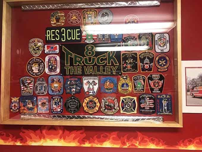 Fire department patches from across the region adorn the walls, creating a genuine tribute to our bravest first responders.