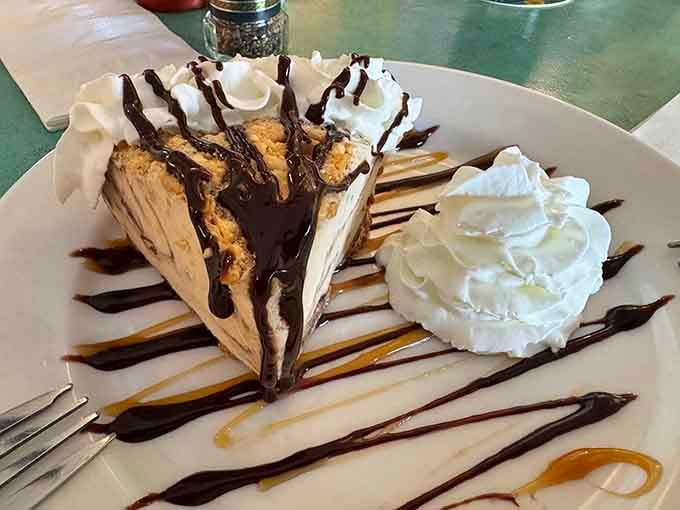 Dessert drizzled with chocolate like an edible Jackson Pollock painting, sweet chaos on a plate.