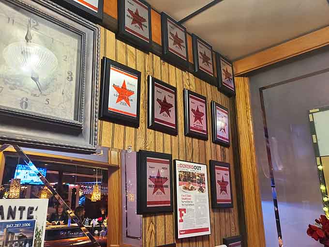 These framed accolades on the wall tell the story of decades spent perfecting the art of the steakhouse experience.