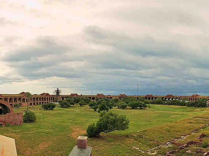 The parade ground stretches out green and peaceful, where soldiers once drilled and tourists now wander in happy confusion.