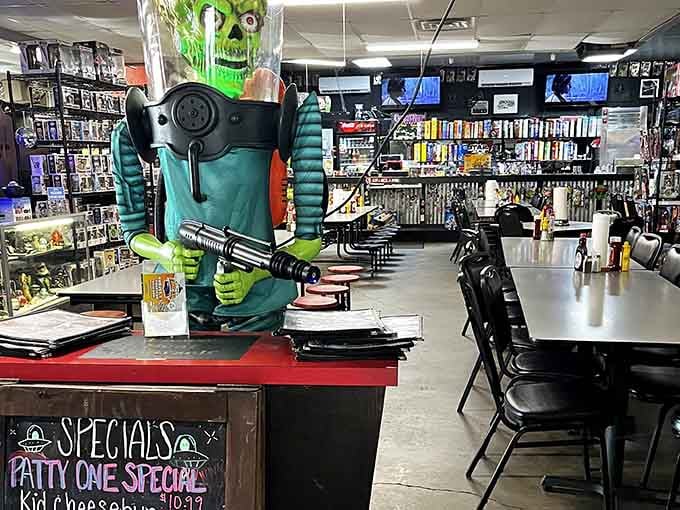 That green alien mascot watching over the counter adds whimsy without overwhelming the laid-back diner atmosphere.