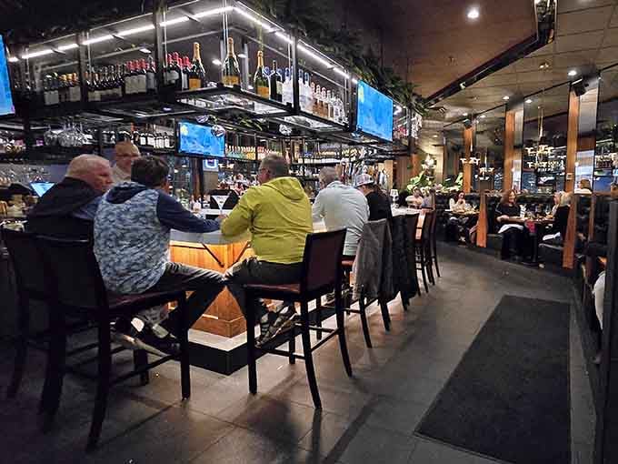 The bar area buzzes with conversation and clinking glasses, where good drinks meet even better company any night.