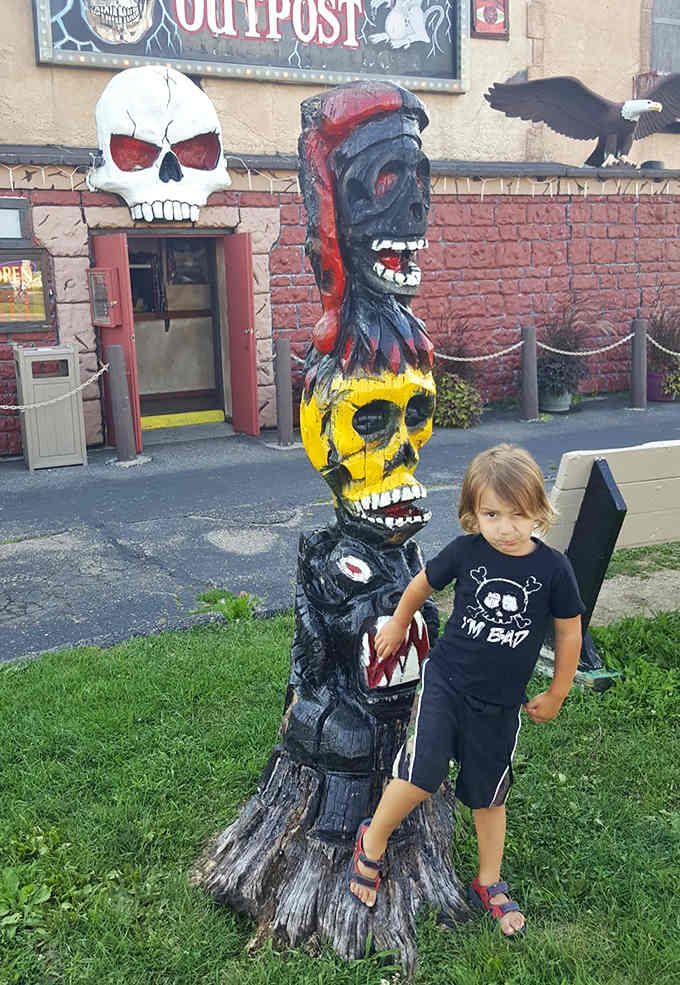 This totem pole of terror stands guard outside like the world's most unsettling lawn ornament you've ever encountered.