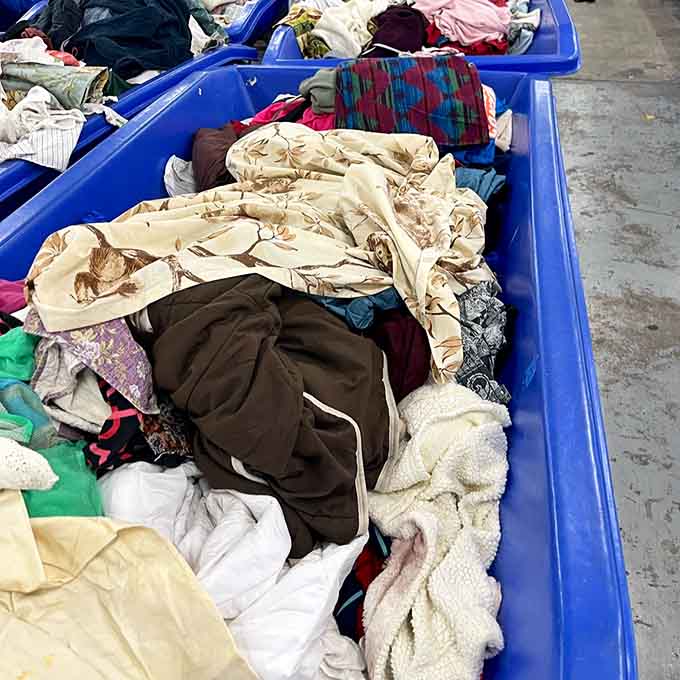 Neutral linens pile high because even your bedding dreams can come true when you're paying by the pound.