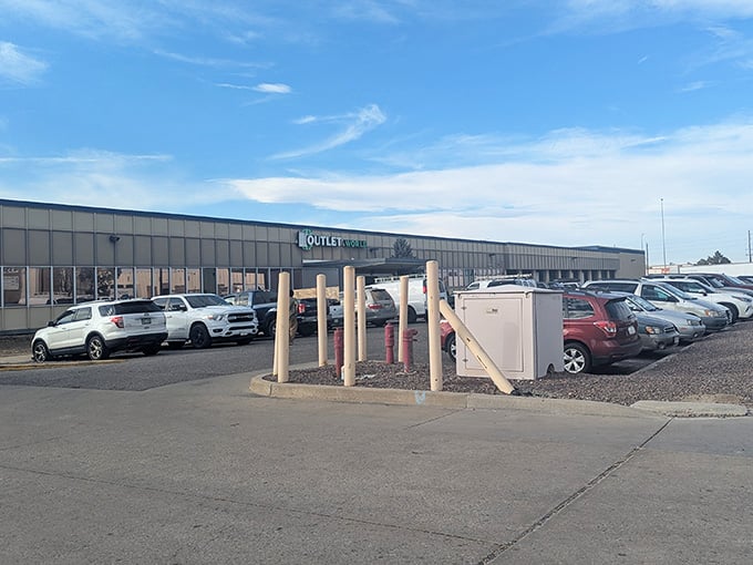 The warehouse interior buzzes with activity as shoppers navigate rows of bins under bright industrial lighting.