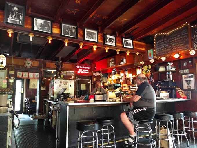 The bar area invites lingering conversations and cold beers, where strangers become friends over Reubens.
