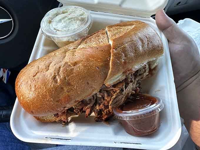 This pulled pork sandwich is stuffed so generously, it's practically bursting with smoky, tender meat goodness throughout.