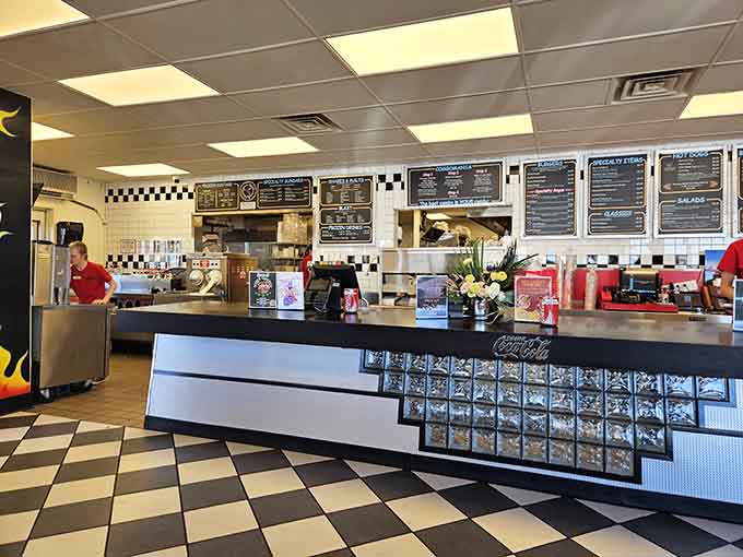 The ordering counter gleams with chrome and possibility, where decisions are made and happiness is dispensed daily.