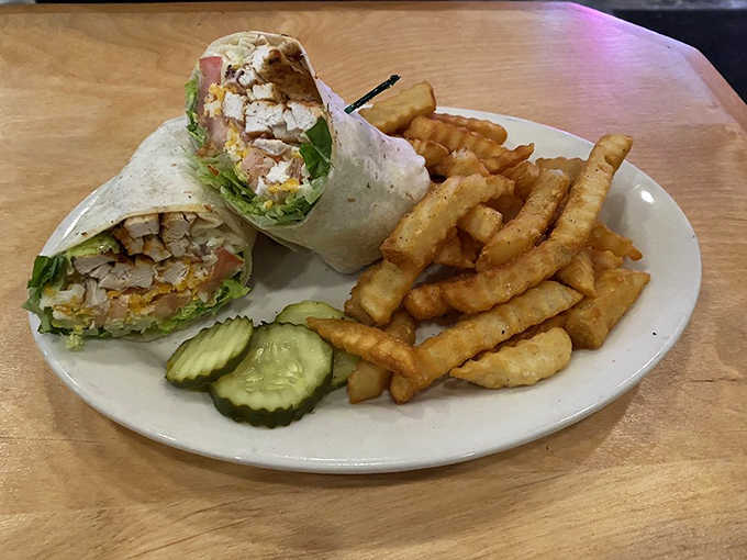 Grilled chicken wrapped tight with fresh vegetables, proving healthy choices can still make your taste buds dance happily.