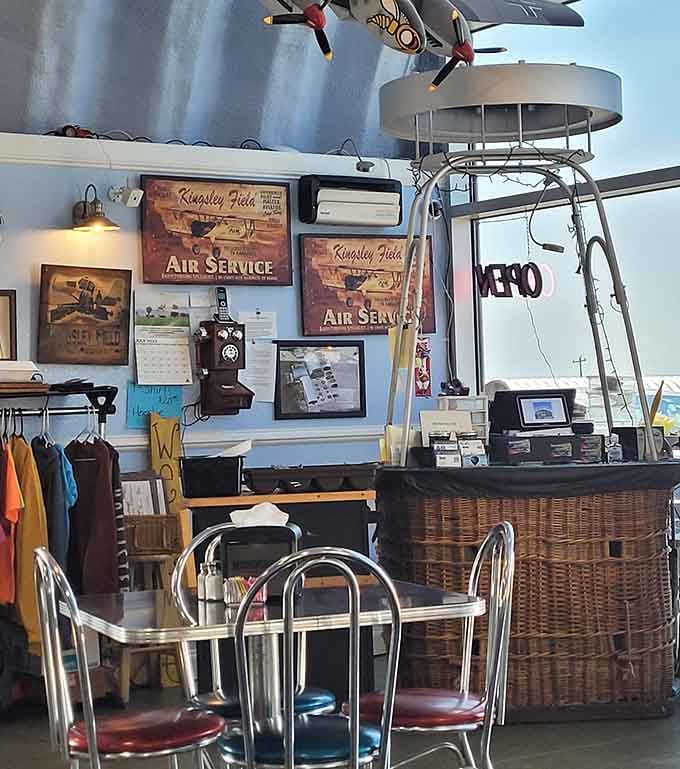 The order counter where magic happens, surrounded by enough aviation decor to make any pilot feel right at home.
