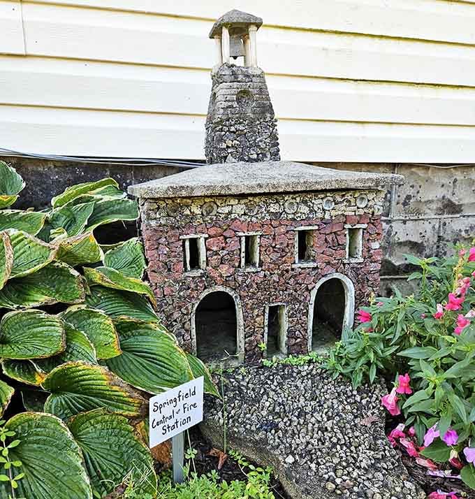This tiny bell tower shows the meticulous detail in every structure, right down to the carefully placed pebbles forming perfect patterns.