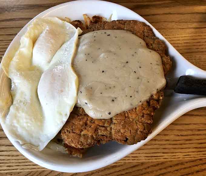 Country fried steak with gravy and eggs: comfort food that hugs you from the inside out, Minnesota style.