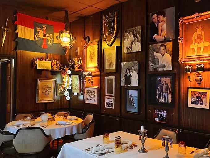 Vintage photographs and German flags create a dining room that feels like eating in someone's very well-decorated European family home.