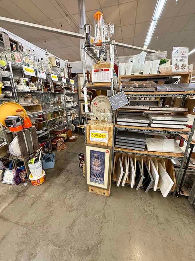 Kitchen treasures stacked with the precision of a Jenga master who really, really loves vintage dishware and glassware.