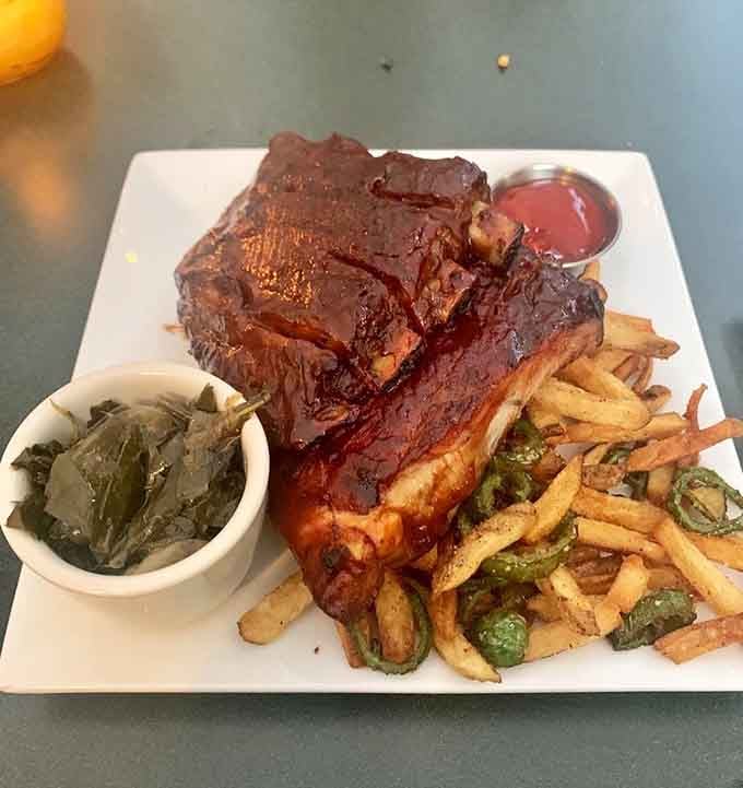 St. Louis ribs glazed to perfection with collards on the side, because someone here understands proper Southern barbecue traditions.