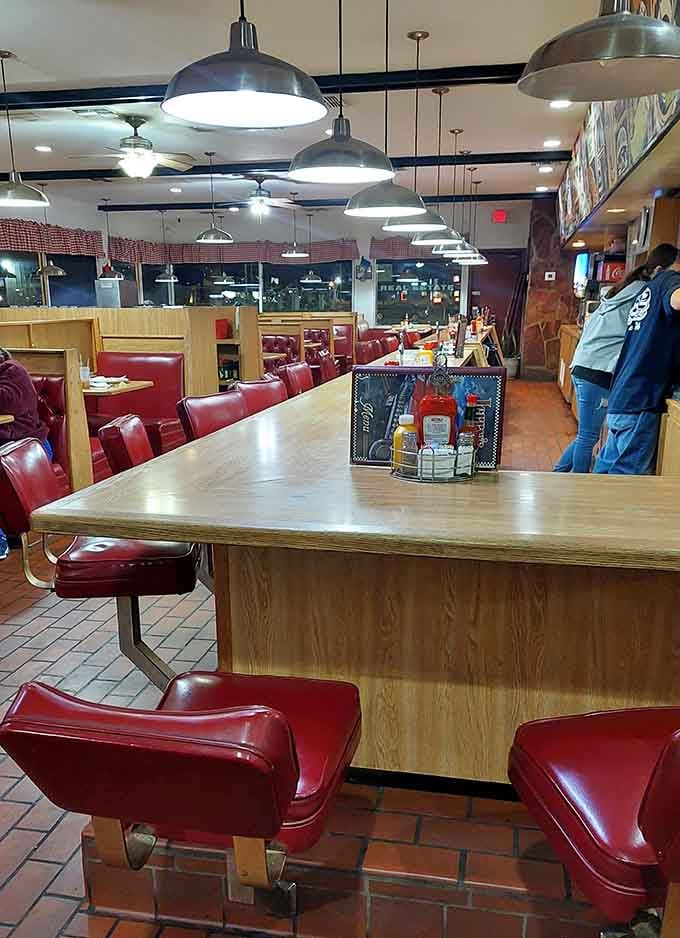 The counter seating offers front-row views of breakfast magic happening in real time behind the scenes.