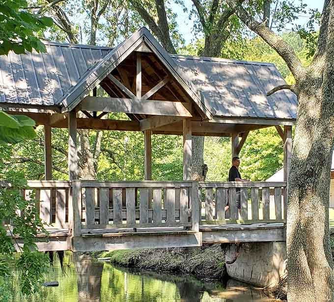 A covered bridge offers creek crossings with architectural charm that modern concrete spans will never quite manage to achieve.