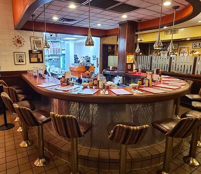 The curved counter seating offers front-row views of the kitchen action, dinner and a show without the ticket price.