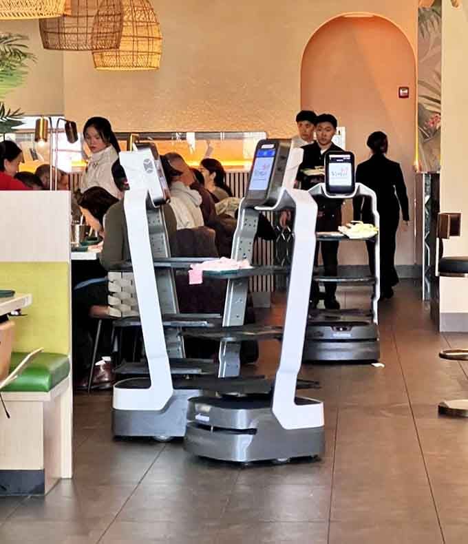 Robot waiters gliding through the restaurant like something from The Jetsons, except they're delivering real food to real people.