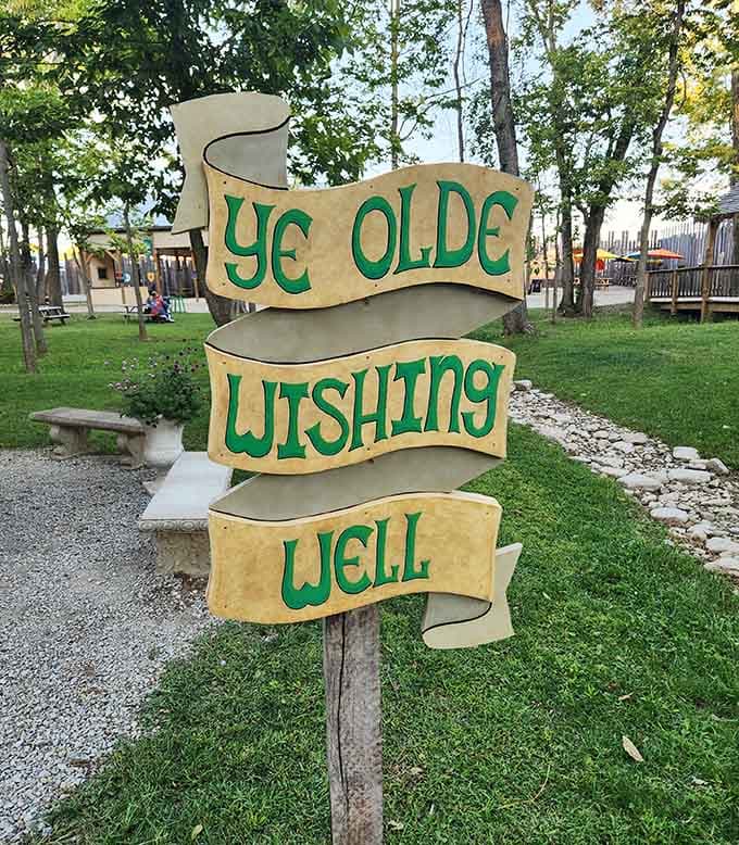 Ye Olde Wishing Well invites visitors to toss coins and make wishes, because even medieval villages need a little magic.