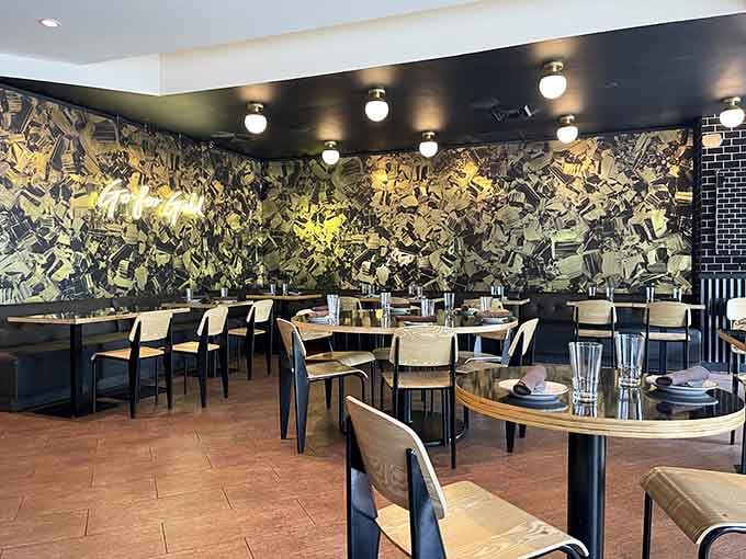 Bold wall art adds energy to the dining room, though the real showstopper will be arriving on your plate.