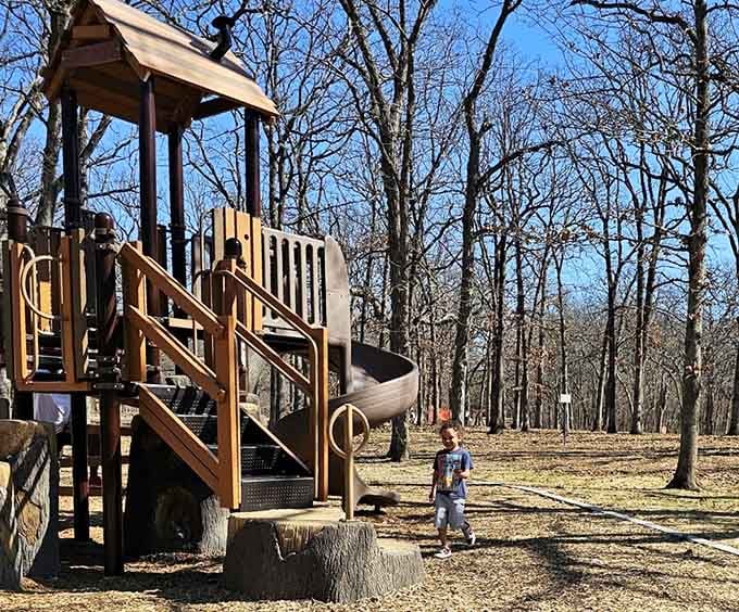 Kids burn energy on playground equipment while parents enjoy views that make supervision actually pleasant.