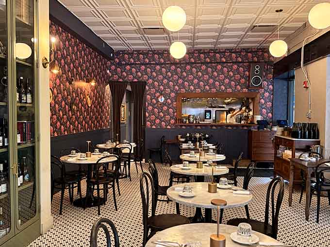 Vintage speakers and patterned wallpaper create a dining room that feels like your coolest friend's Parisian apartment.