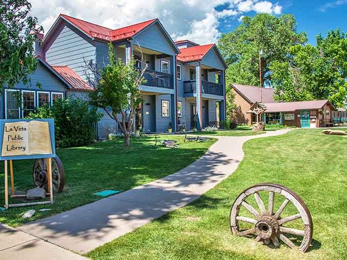 The public library's red roof and welcoming lawn remind you that community spaces still matter here.