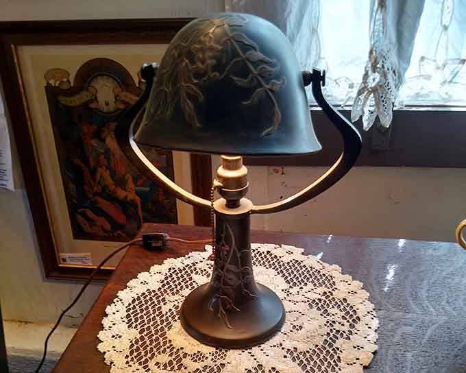 Art Deco lamps casting their glow on treasures below, proving good design never really goes out of style.