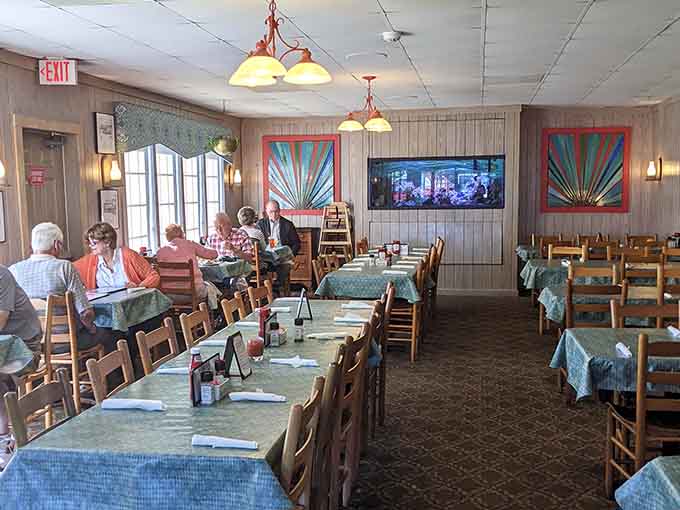 Bright windows and cheerful decor create an atmosphere where every meal feels like a special coastal celebration.
