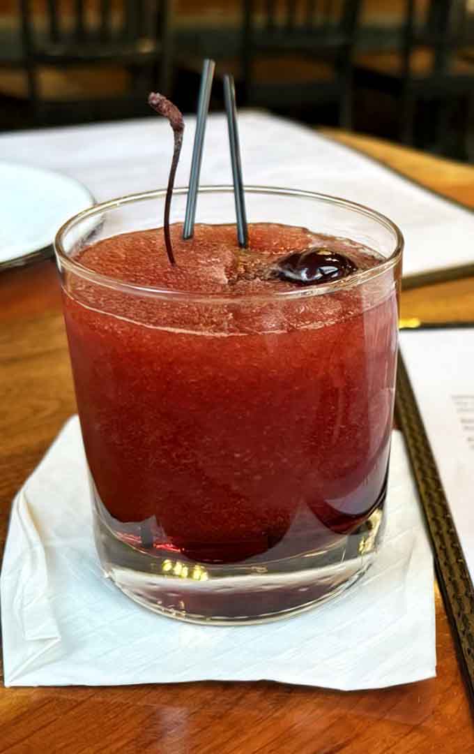 That bourbon slush looks dangerously refreshing, the kind of drink that makes afternoon decisions feel very wise.