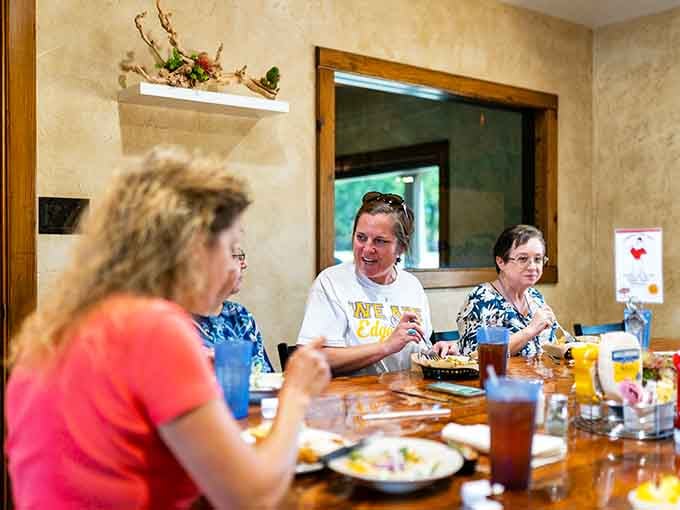 Genuine smiles and shared laughter around the table capture what makes a great meal truly memorable and special.