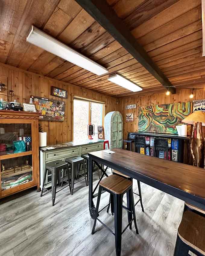 The wood-paneled walls and vibrant art make this dining room feel like your coolest friend's mountain cabin.
