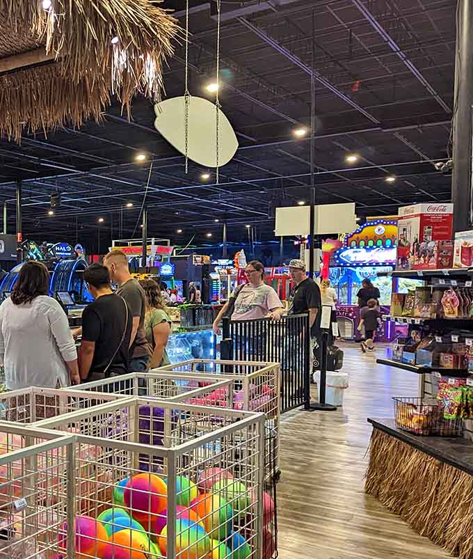 The souvenir shop checkout line where kids become master negotiators and parents learn the true meaning of "just one more thing."