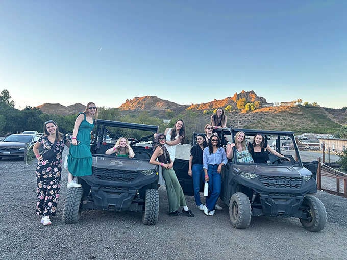 Nothing says "best day ever" quite like a group photo with off-road vehicles at sunset.