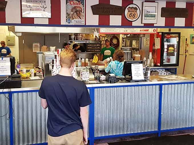 The order counter where burger dreams come true, one perfectly grilled patty at a time for hungry customers.