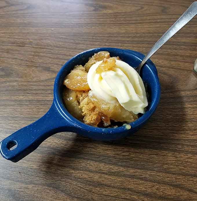 Warm cobbler topped with vanilla ice cream in a cast iron skillet is basically a hug in dessert form.