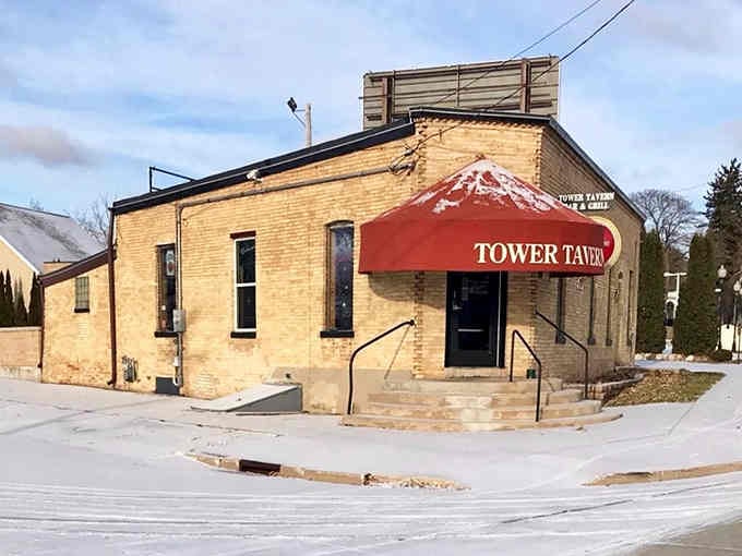 Tower Tavern's classic brick exterior promises the kind of neighborhood bar where everybody eventually knows your name and your usual order.