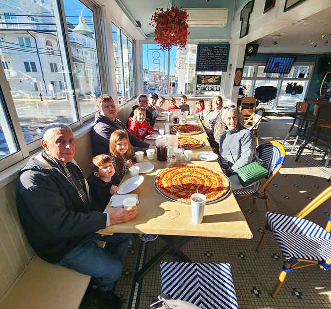 Multi-generational pizza appreciation in action: proof that great food brings families together across the decades and the table.