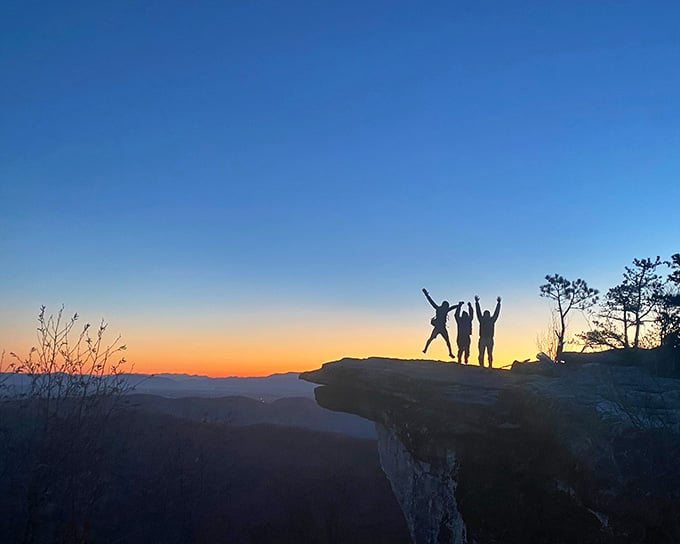 Victory silhouettes at sunset capture that triumphant feeling when your legs finally forgive you for the climb.